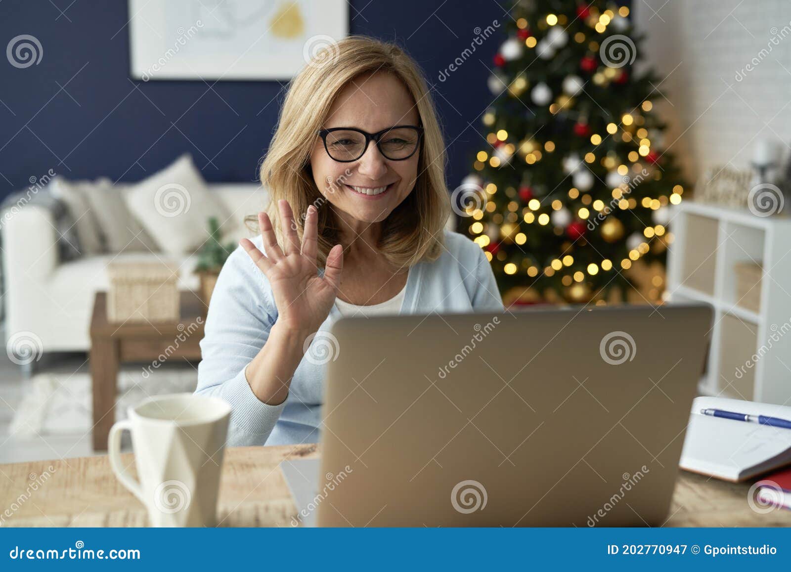 Mature Woman Saying Hello during a Videoconference Stock Image - Image ...