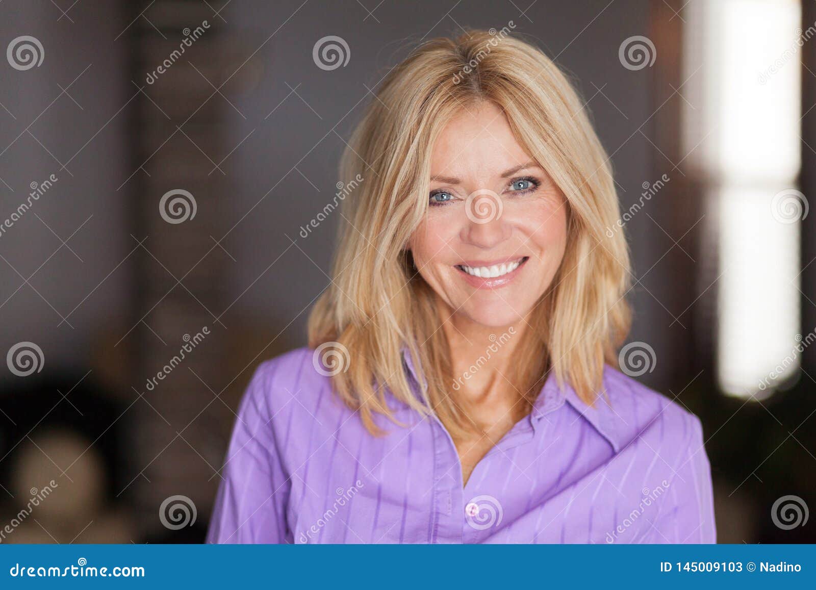 Mature Woman Smiling at the Camera. she Relaxing at Home. Beautiful ... Mature Woman Smiling at the Camera. she Relaxing at Home. Beautiful ...