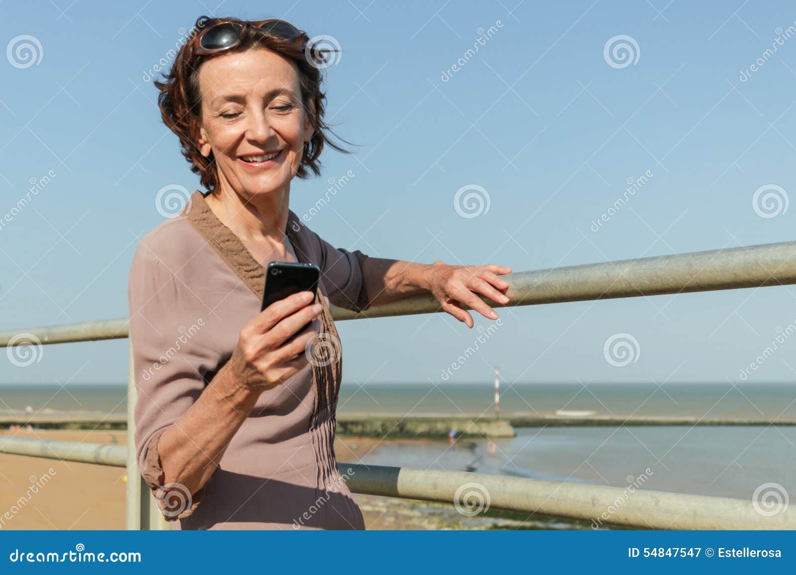 Mature Woman Texting from the Beach Stock Image - Image of slim ...