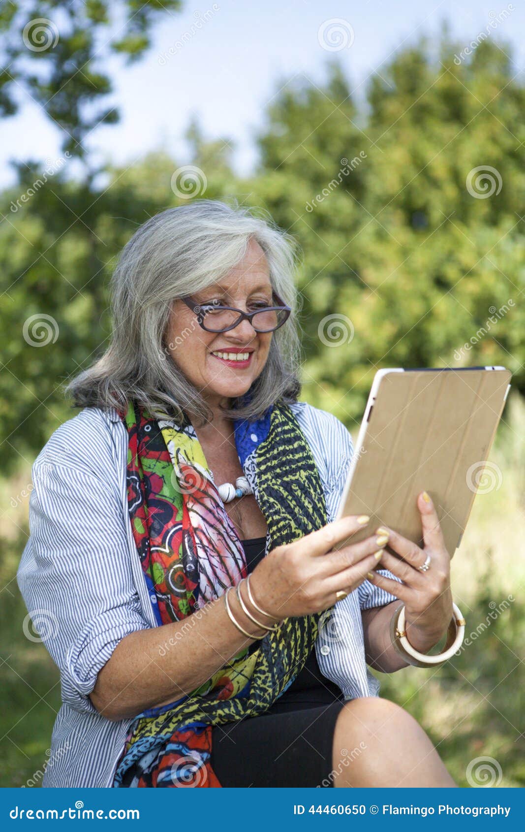 Mature Woman Using Wireless Device Stock Photo - Image of enjoyment ...
