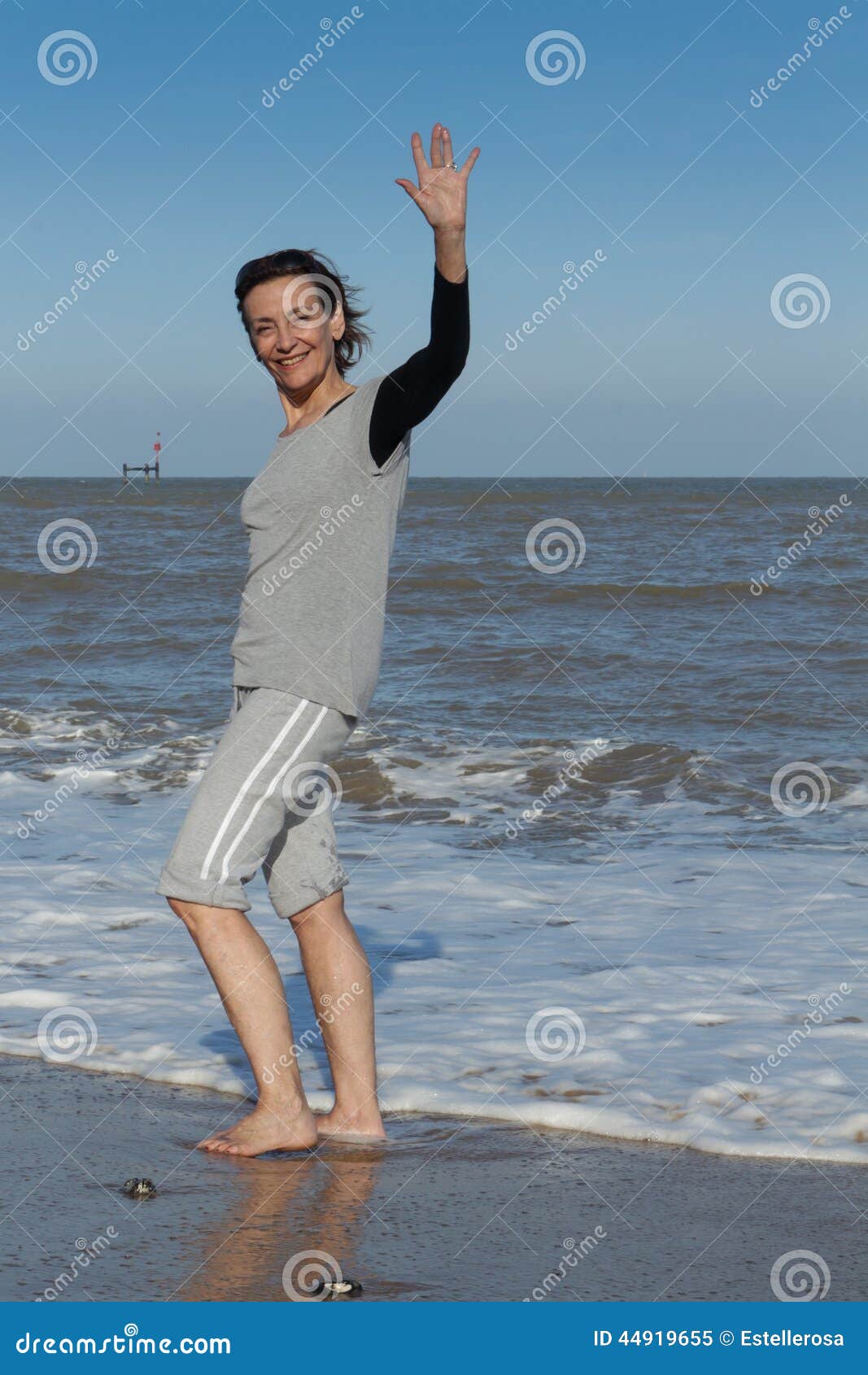Mature Woman Waving from the Sea Stock Image - Image of hair, model ...