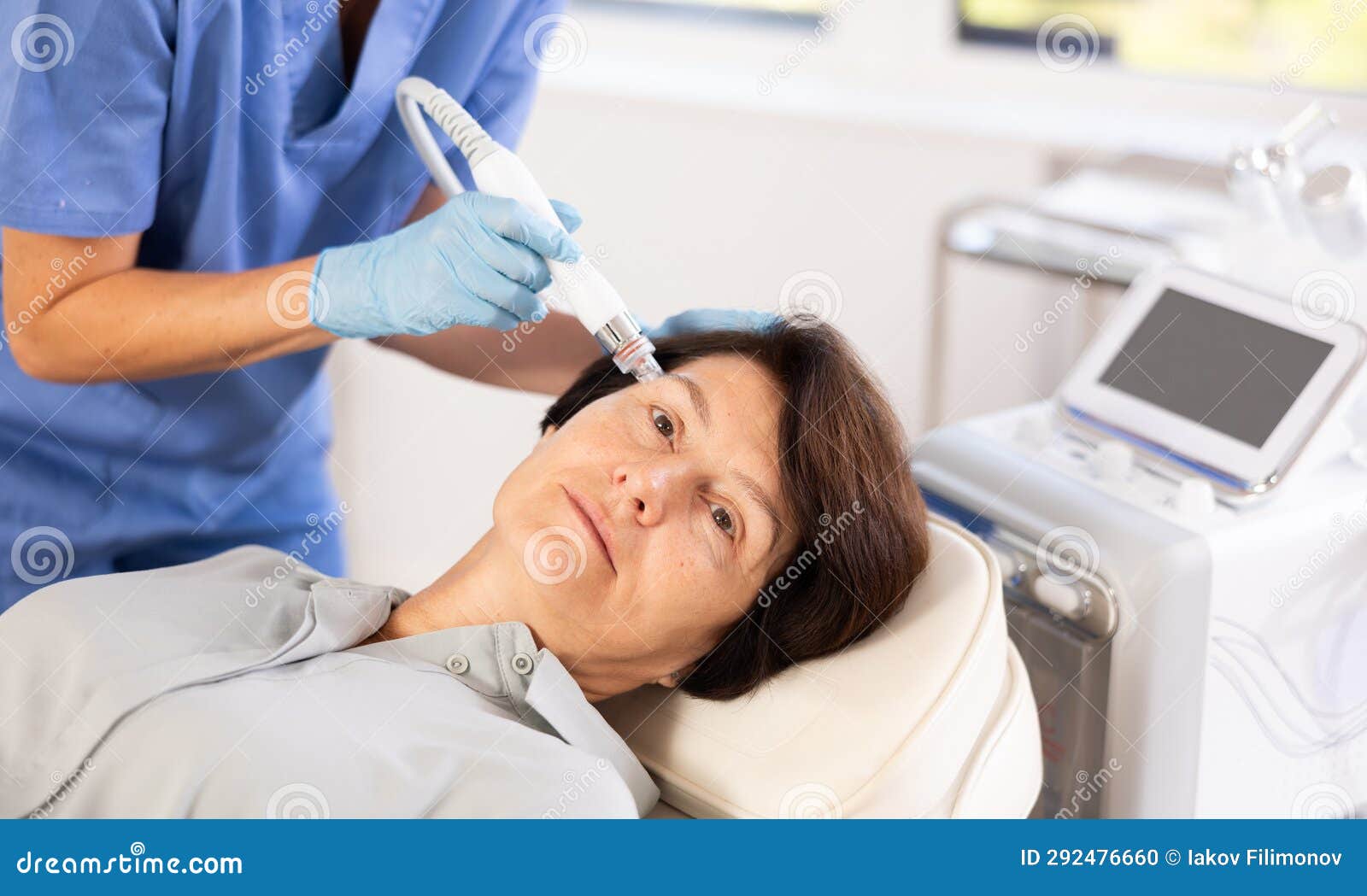 Mature Woman Receiving Facial Procedure with Hydrogen and Oxygen Ions ... Mature Woman Receiving Facial Procedure with Hydrogen and Oxygen Ions ...