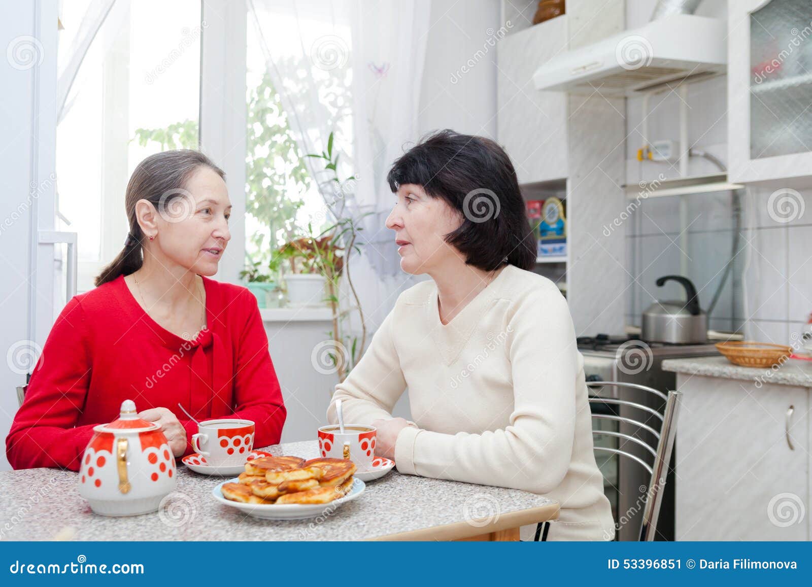 Mature Women Talking at Kitchen Stock Image - Image of adult, seniors ...