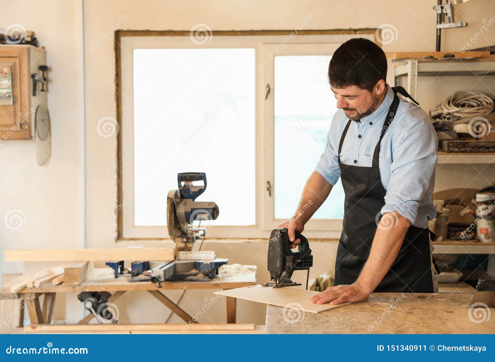 Mature Working Man Using Jigsaw at Carpentry Shop Stock Image - Image ...
