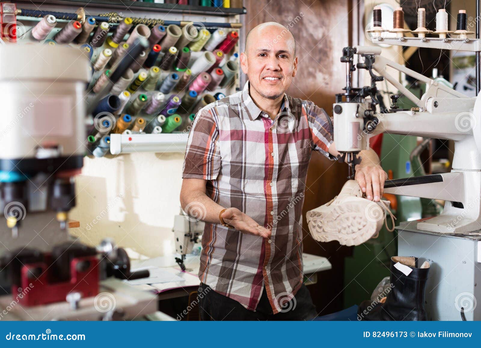 Mature Workman Sewing Leather Boots on Stitch Lathe Stock Image - Image ...