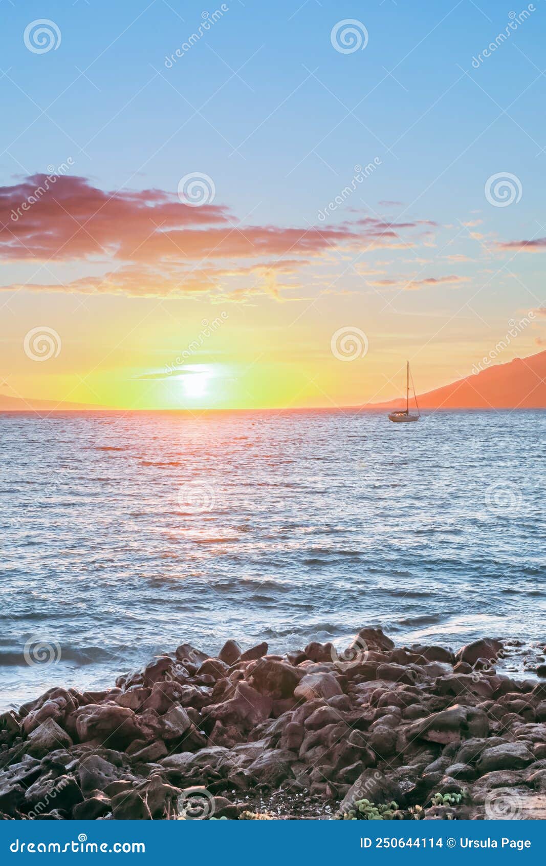 Maui Hawaii at Sunset with a Low Sun and Rocks and a Mountain Stock ...