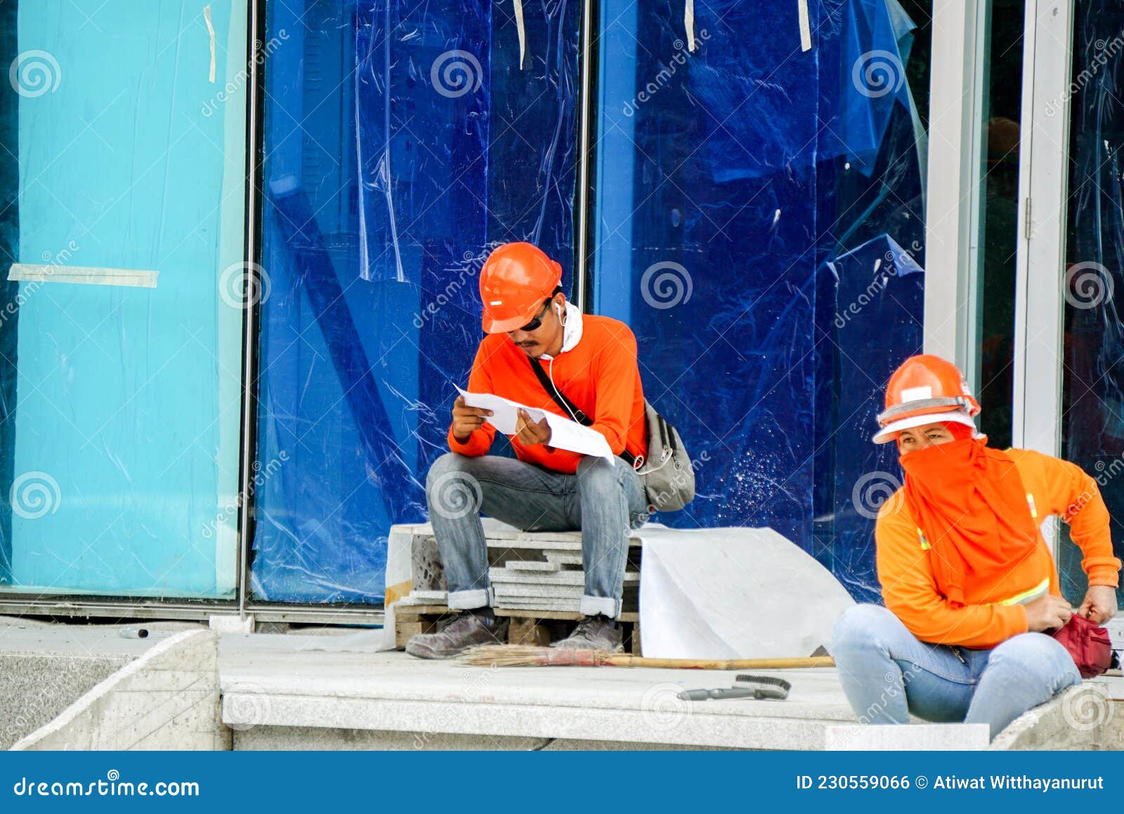 Thai Construction Engineer Reading Construction Plan with Another One ...