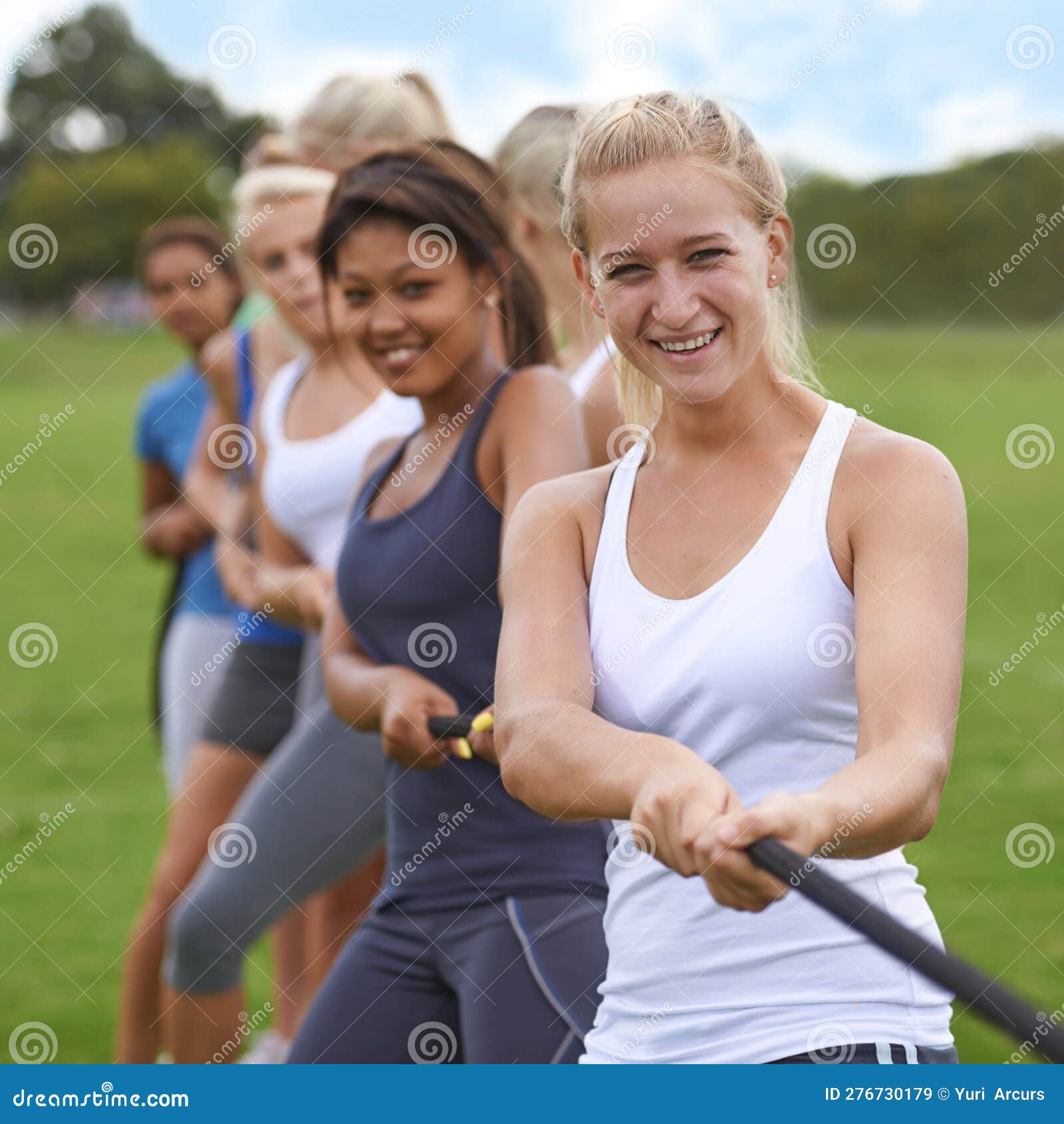 May the Best Woman Win. a Group of Young Woman Engaged in a Tug of War ...