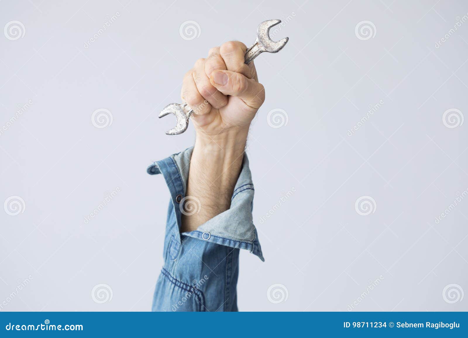 1 May Labor Day, Man Hand with Wrench Tool on Grey Background Stock ...