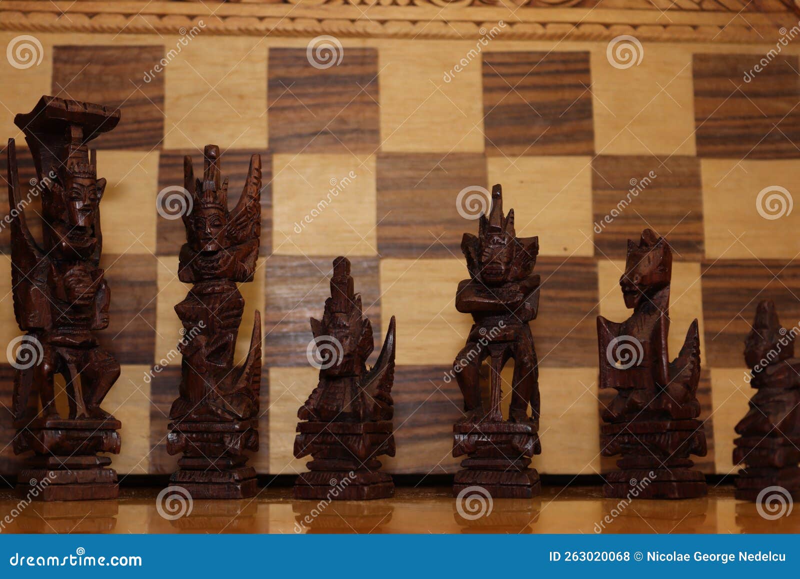 Mayan Chess Pieces Photographed on a Background Showing a Chess Board ...
