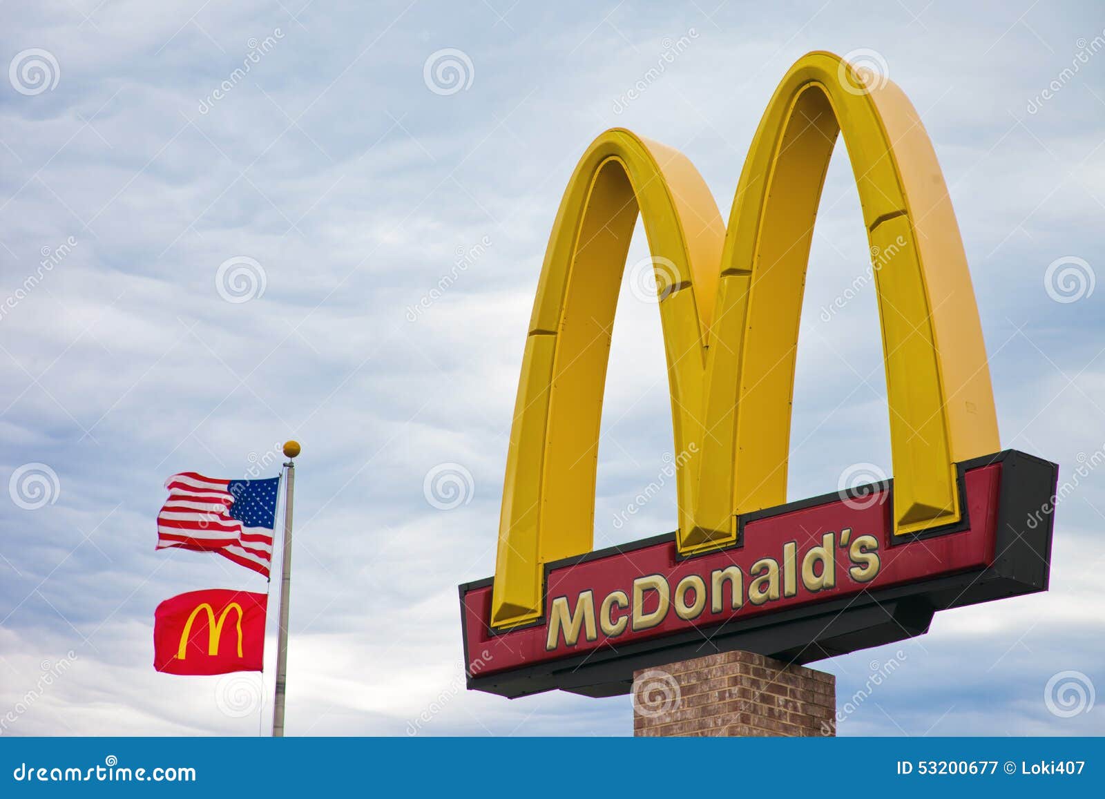 McDonalds arch and flags editorial photography. Image of fast - 53200677