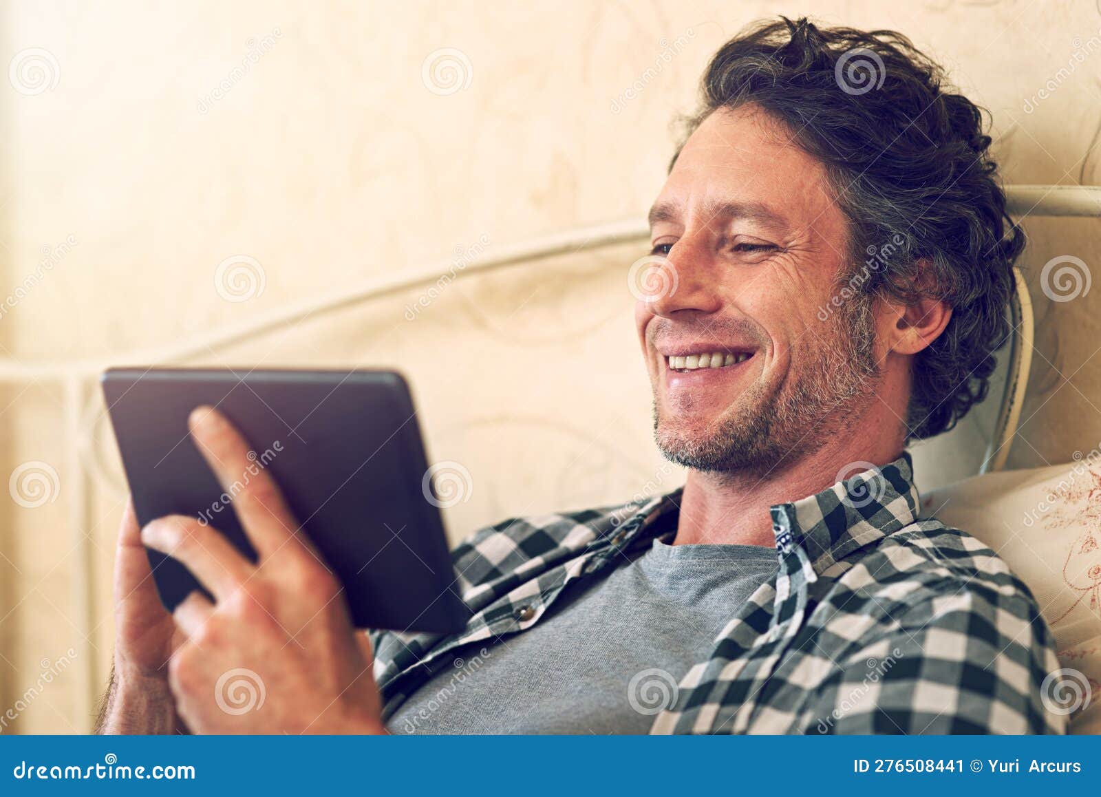 Me Time, Online. a Man Working on His Tablet in Bed. Stock Image ...