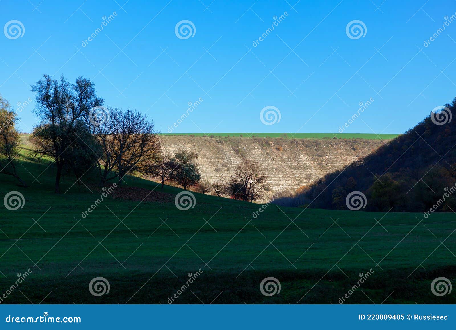Meadow in the hill shadow stock image. Image of high - 220809405