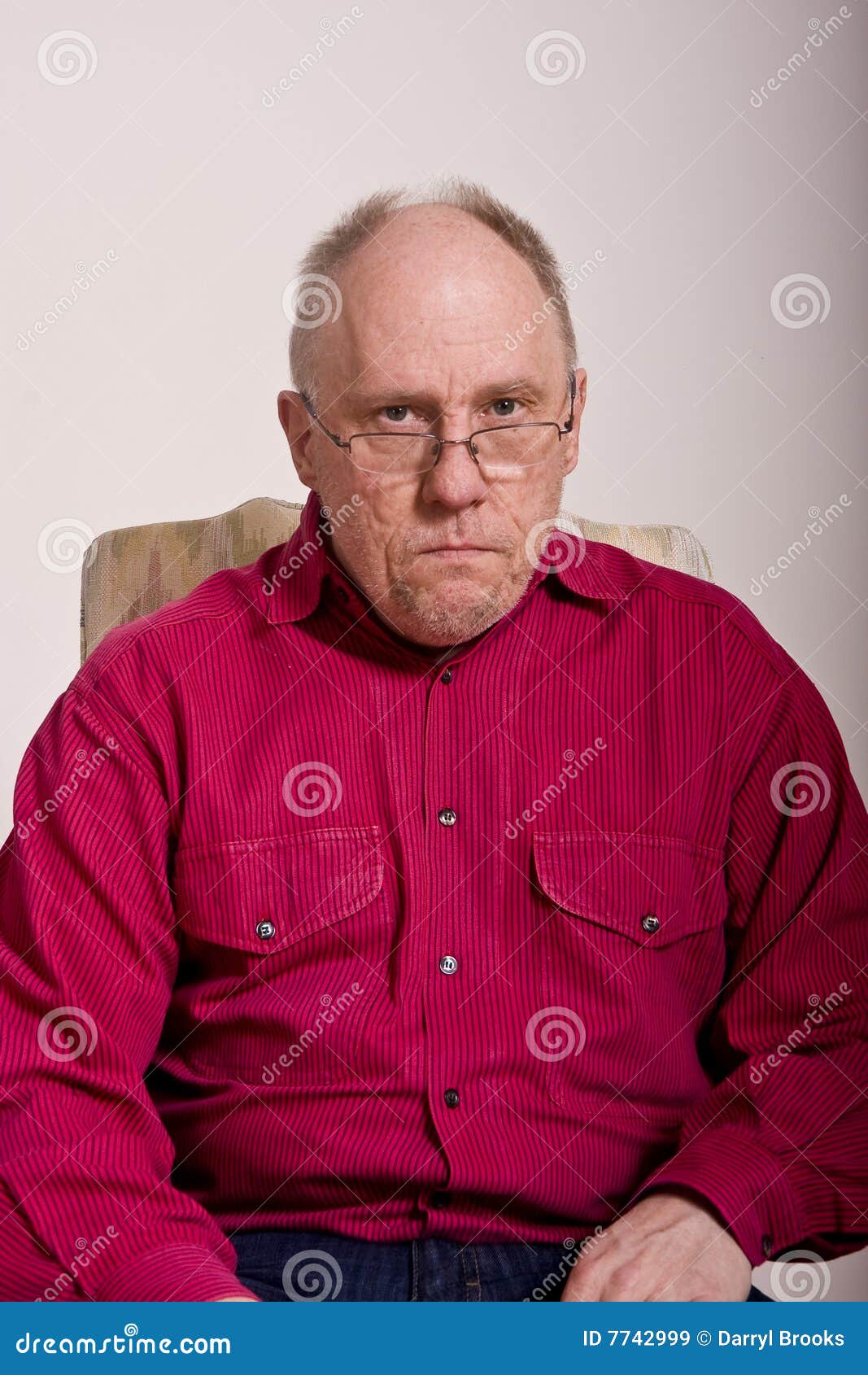 Mean Looking Man in Red Shirt Stock Image - Image of glasses, stern ...