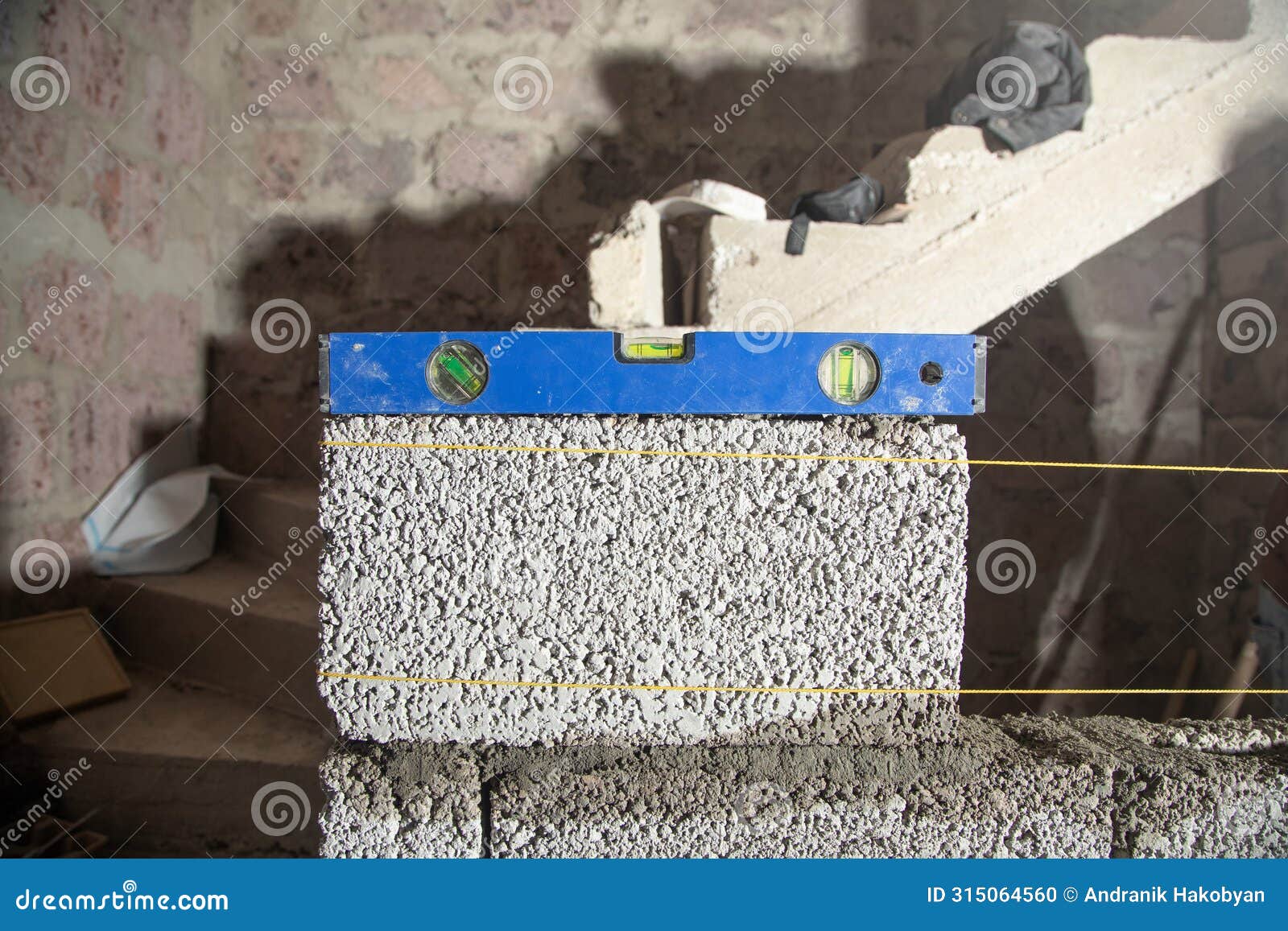 Measure Level on Brick Wall in Construction Site Stock Photo - Image of ...