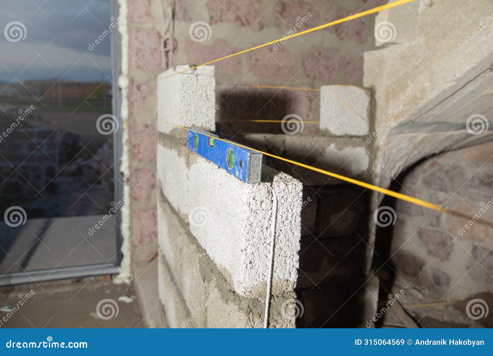 Measure Level on Brick Wall in Construction Site Stock Image - Image of ...