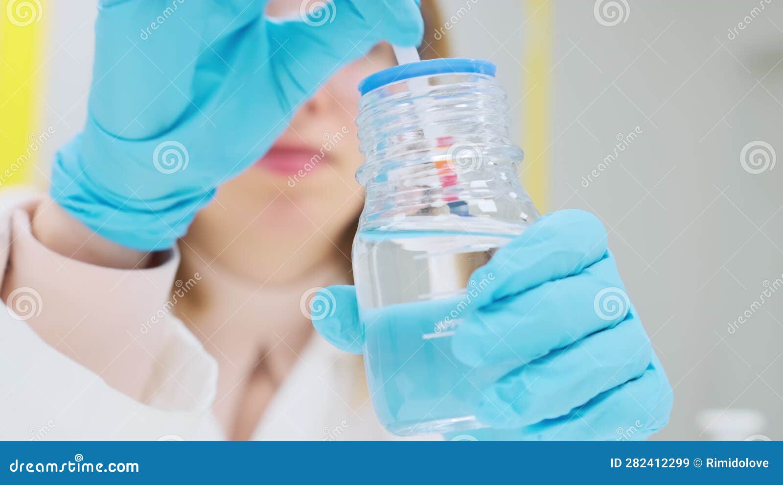 Measurement of PH of the Solution Using Indicator Paper. Scientist in ...