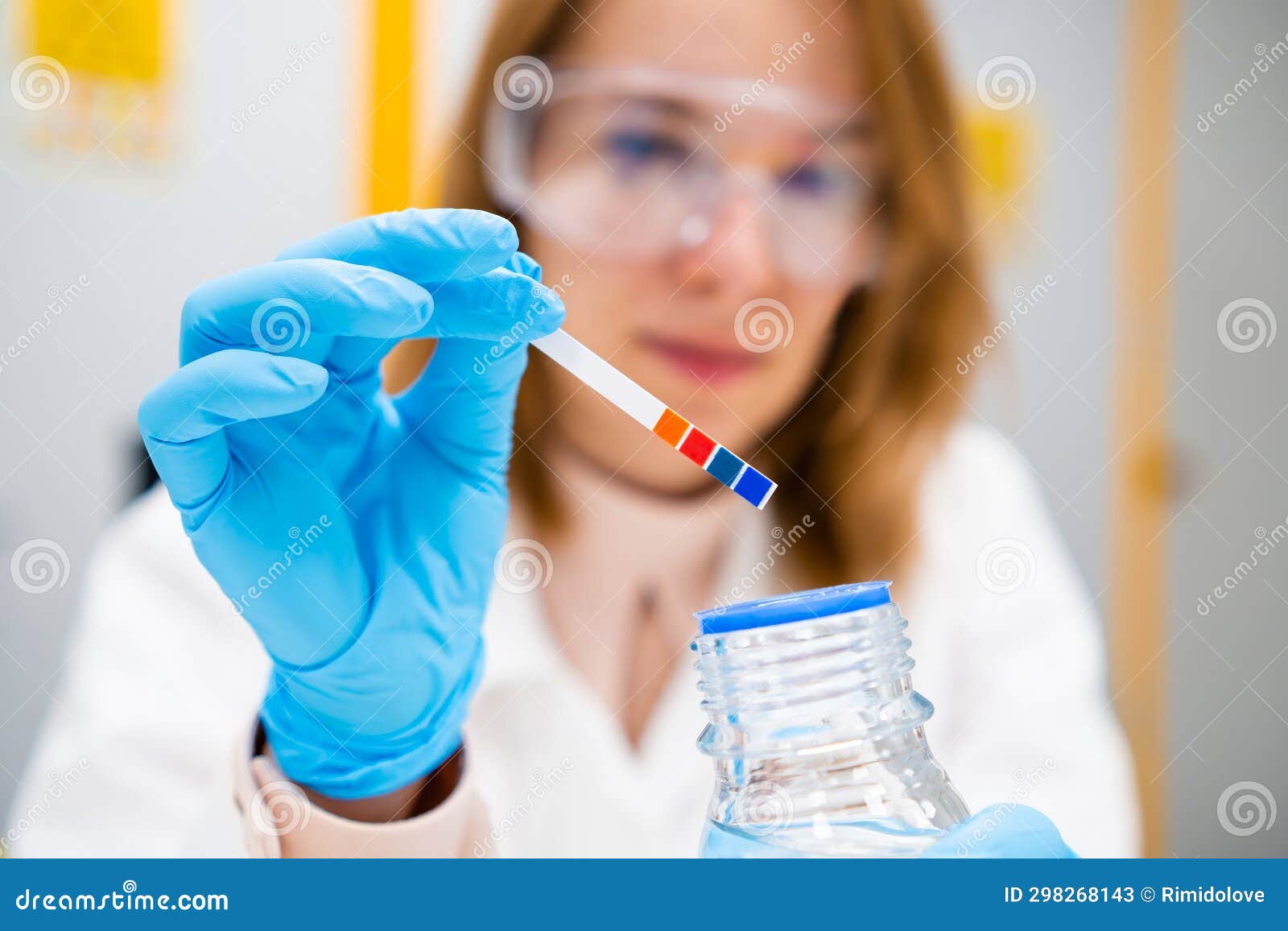 Measurement of PH of the Solution Using Indicator Paper. Scientist in ...