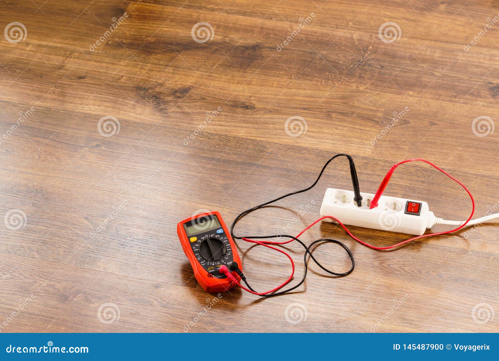 Measurement Voltage in Electrical Socket with Multimeter Stock Photo ...