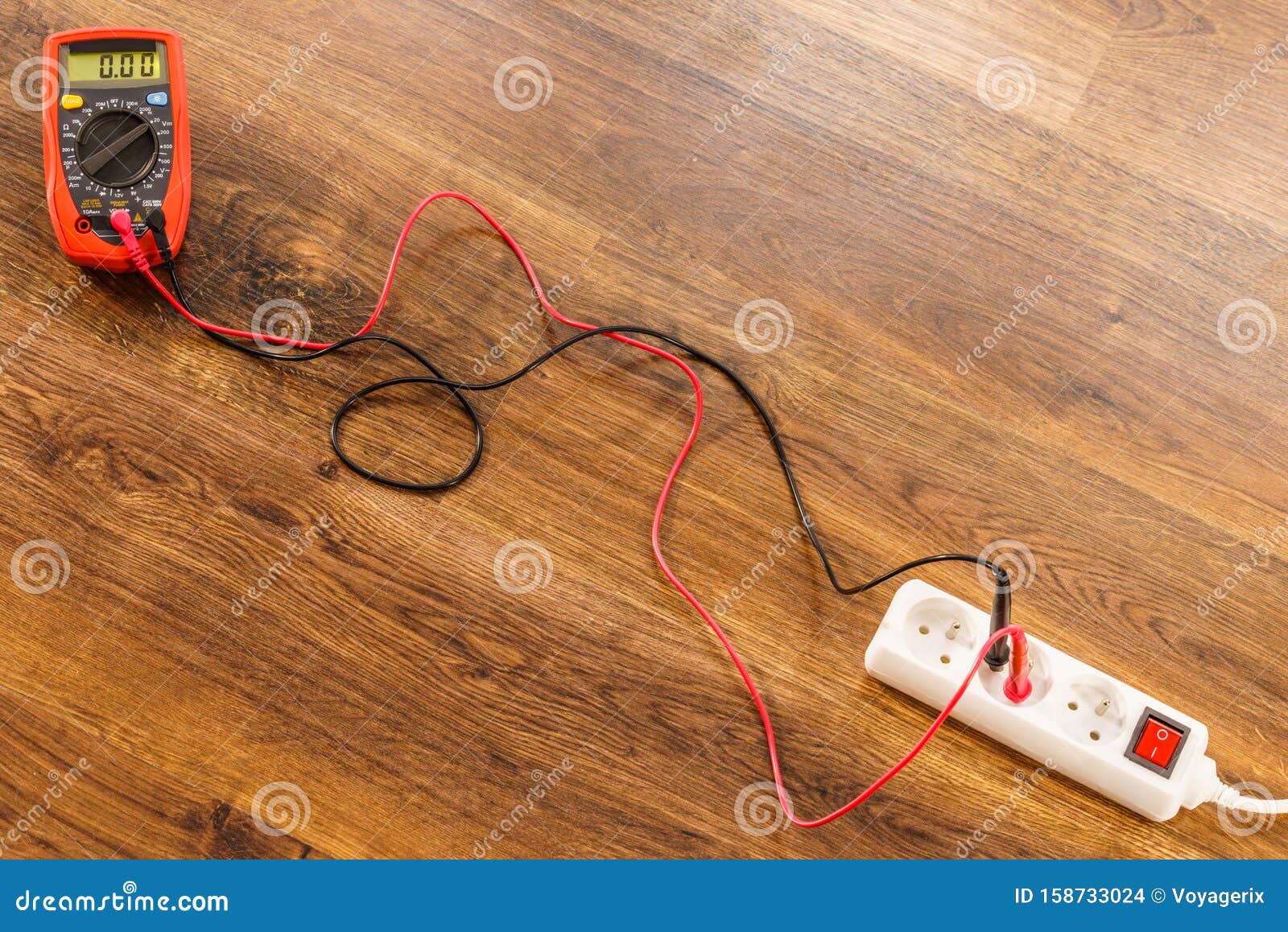Measurement Voltage in Electrical Socket with Multimeter Stock Photo ...