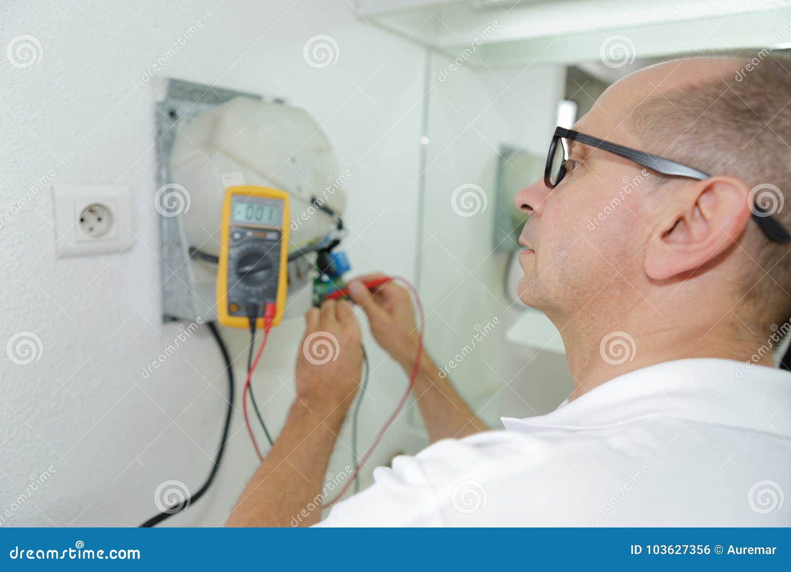 Measurement Voltage in Electrical Socket with Multimeter Stock Photo ...