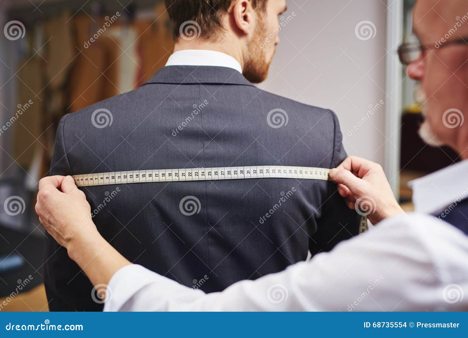 Measuring back of jacket stock photo. Image of dressmaker - 68735554