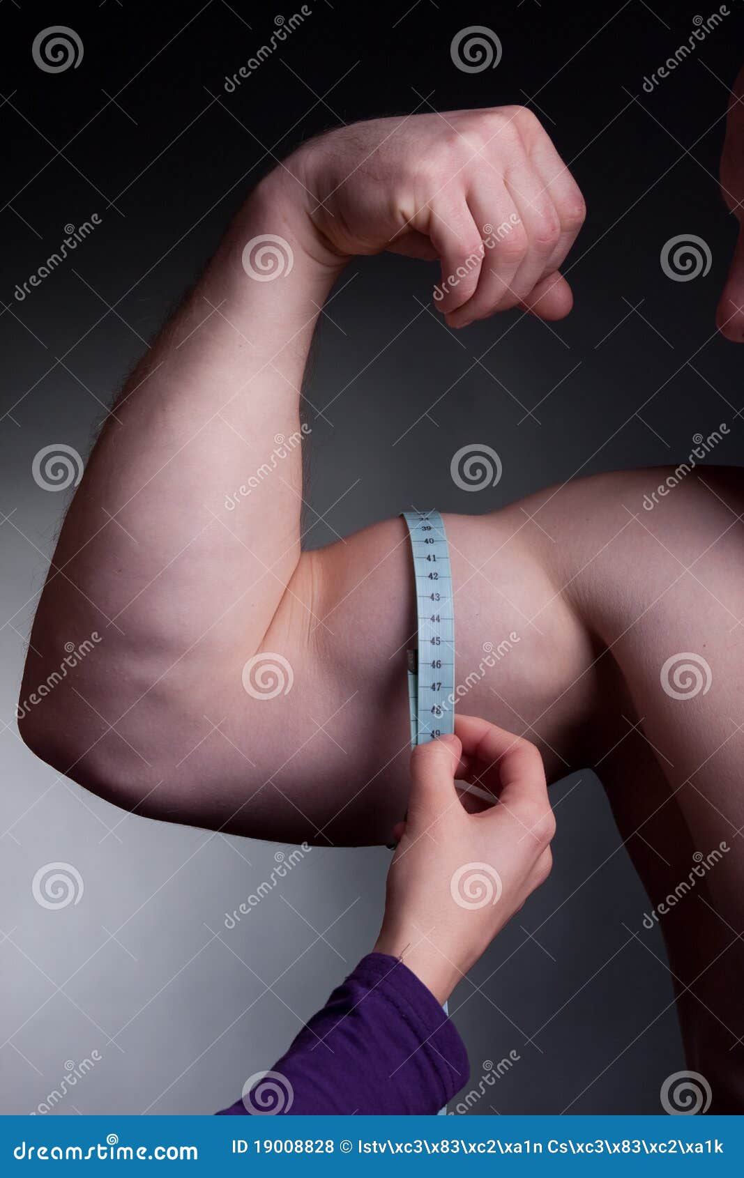 Measuring bicep stock photo. Image of handsome, energy - 19008828