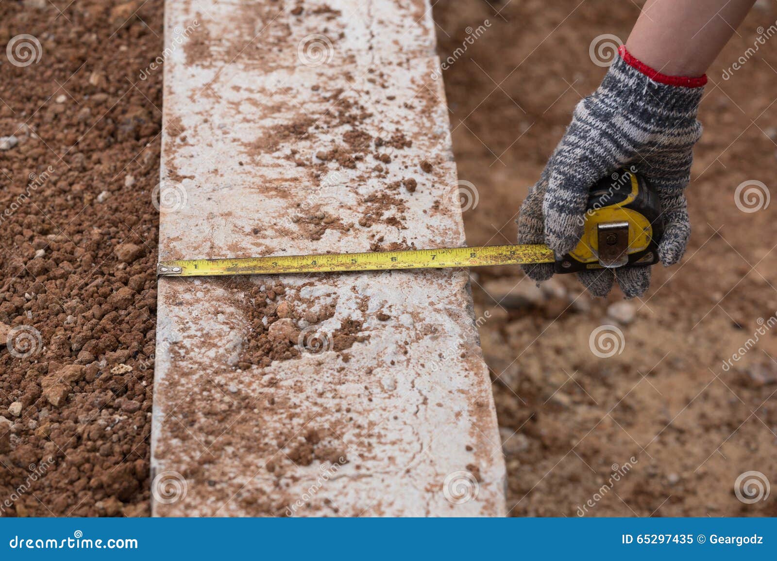 Measuring Concrete at Construction Site with Tape Measure Stock Image ...