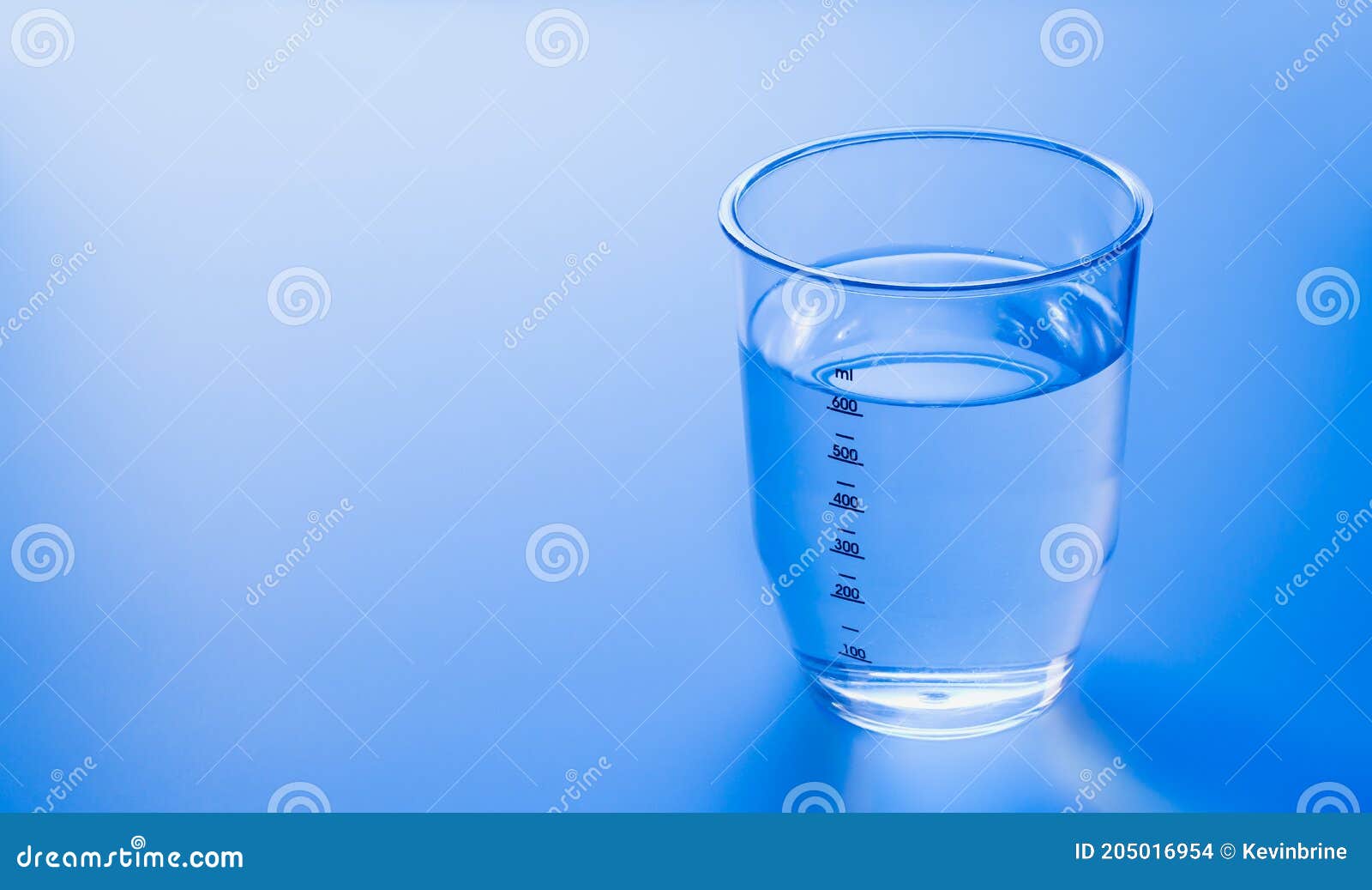 Measuring Cup on Blue stock photo. Image of cylinder - 205016954