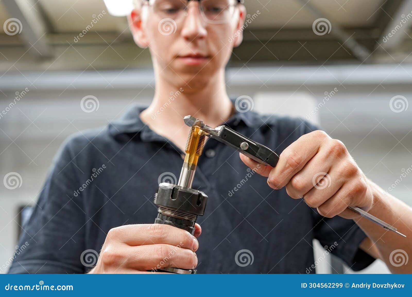 Measuring a Cutting Tool with a Caliper for a CNC Machine Tool Stock ...