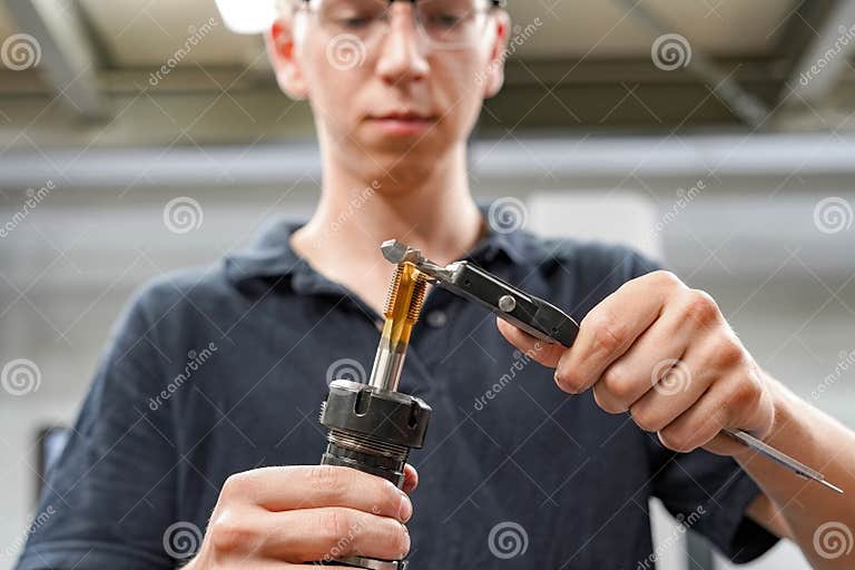 Measuring a Cutting Tool with a Caliper for a CNC Machine Tool Stock ...