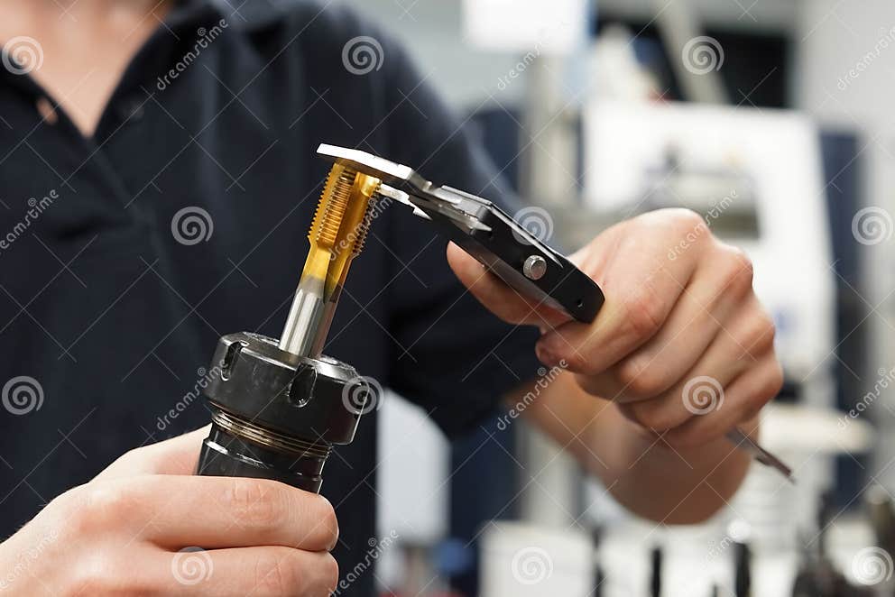 Measuring a Cutting Tool with a Caliper for a CNC Machine Tool. Stock ...