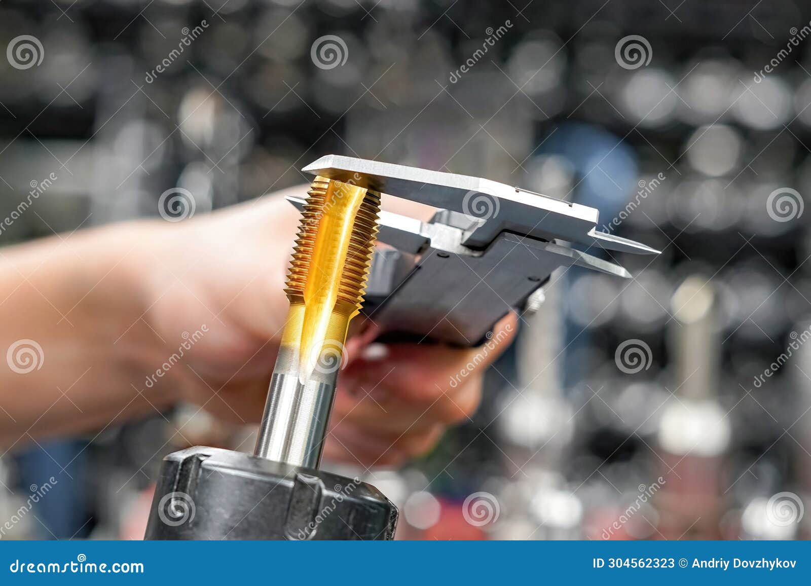 Measuring a Cutting Tool with a Caliper for a CNC Machine Tool. Stock ...