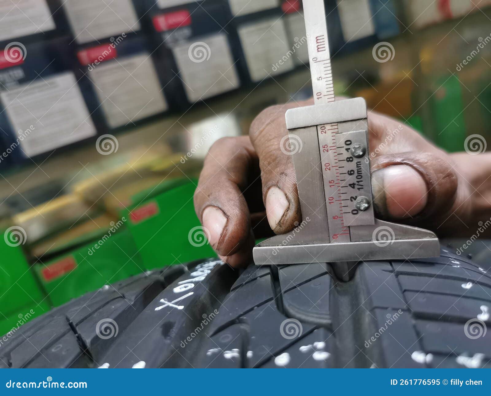 Measuring deep thread tire stock image. Image of firearm - 261776595