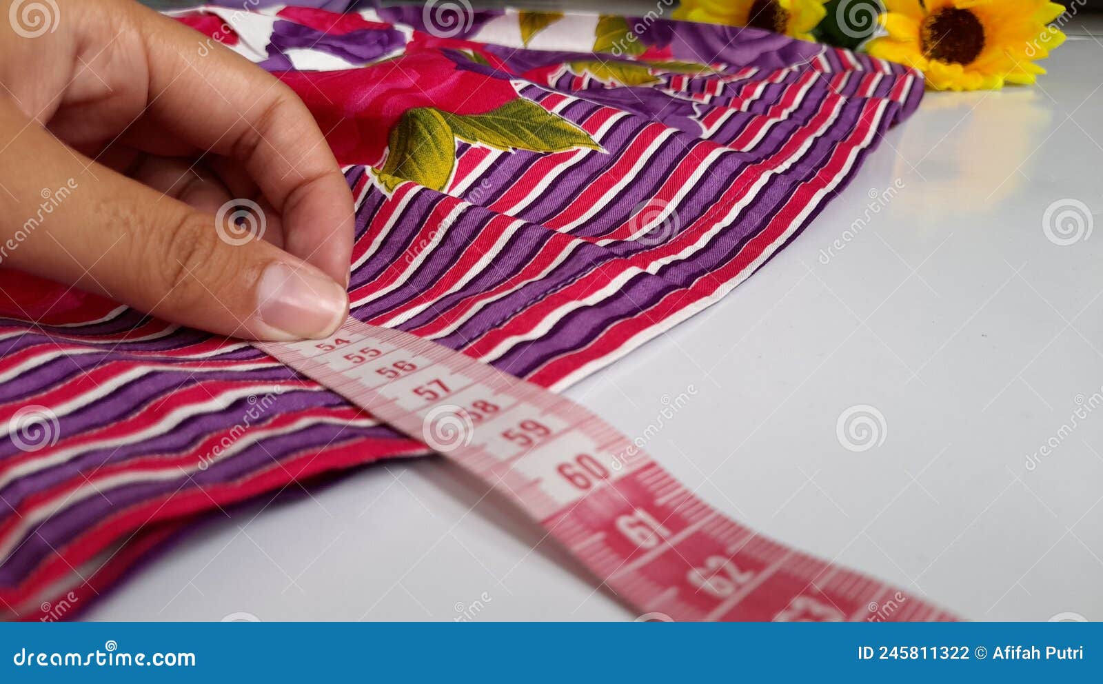 Measuring Fabric for Sewing Using a Fabric Meter on a White Background ...