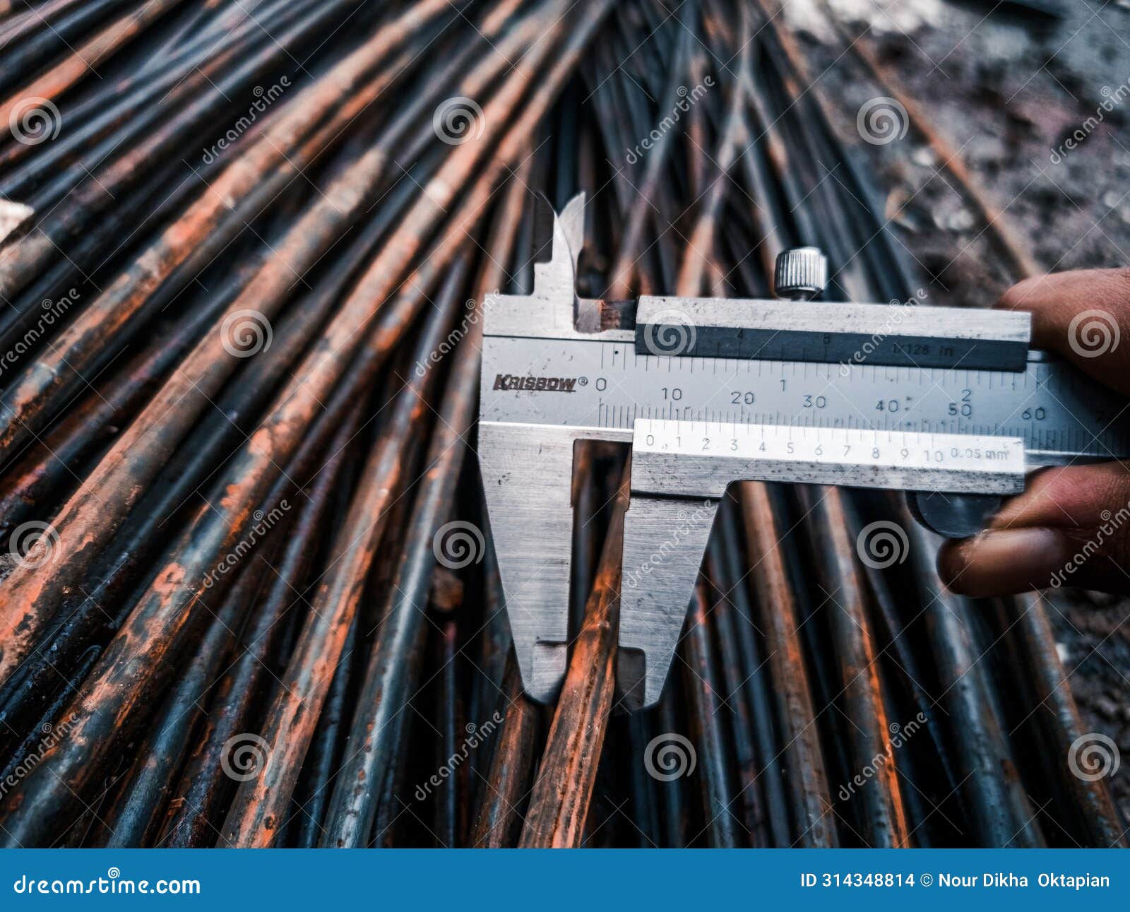 Measuring Iron Using a Sliding Caliper Stock Photo - Image of measuring ...