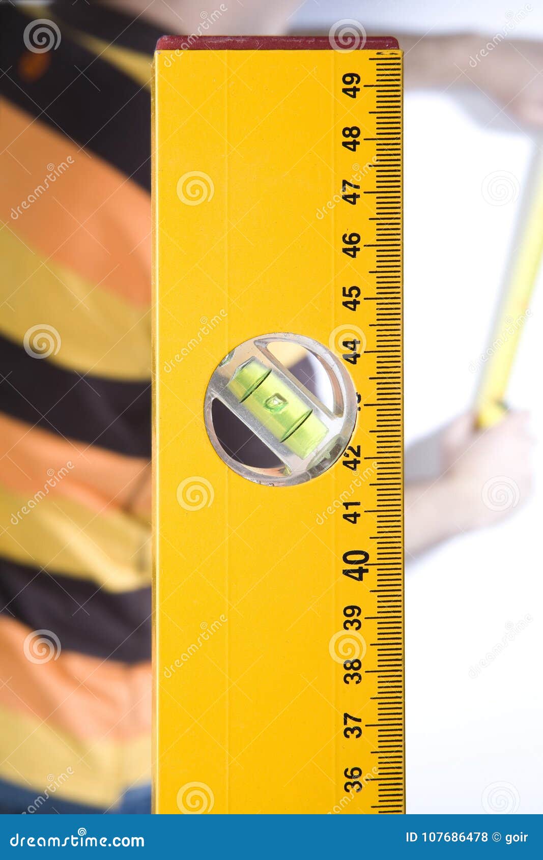 Measuring with level tool stock photo. Image of construction - 107686478