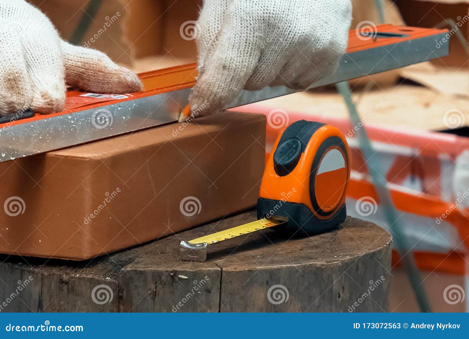 Measuring and Marking Bricks during the Construction of House Stock ...