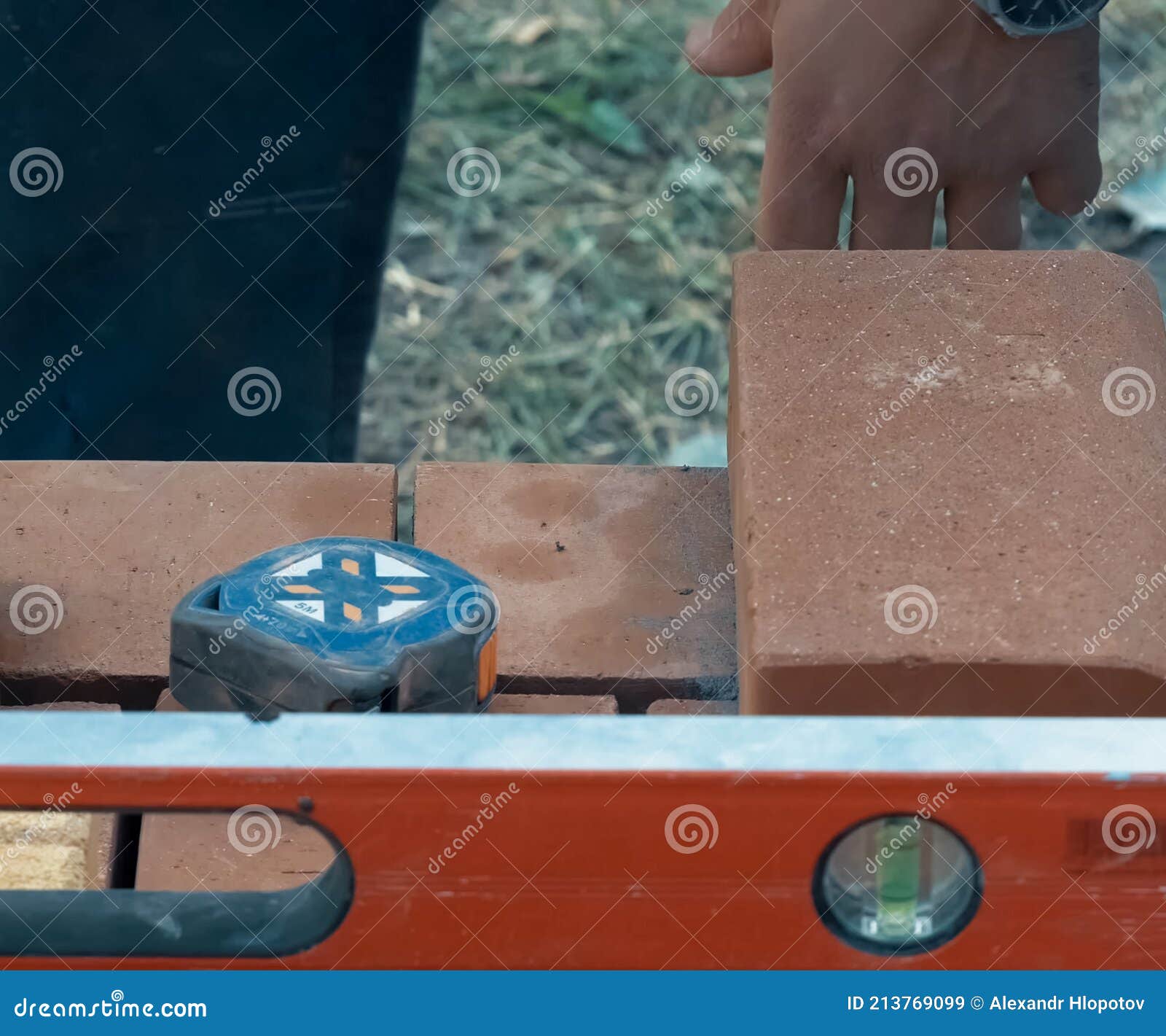Measuring and Marking Bricks during the Construction of House Stock ...