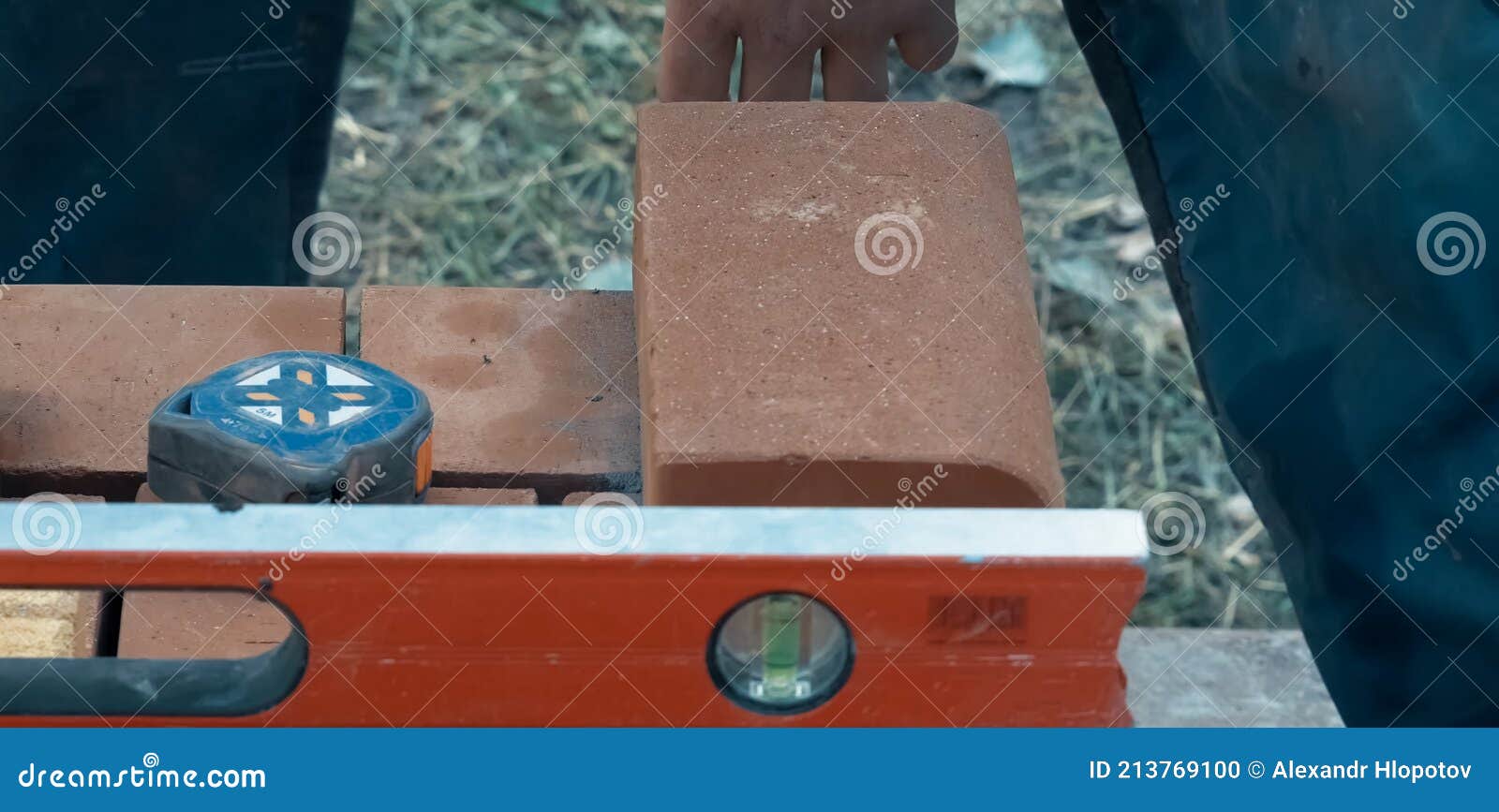 Measuring and Marking Bricks during the Construction of House Stock ...