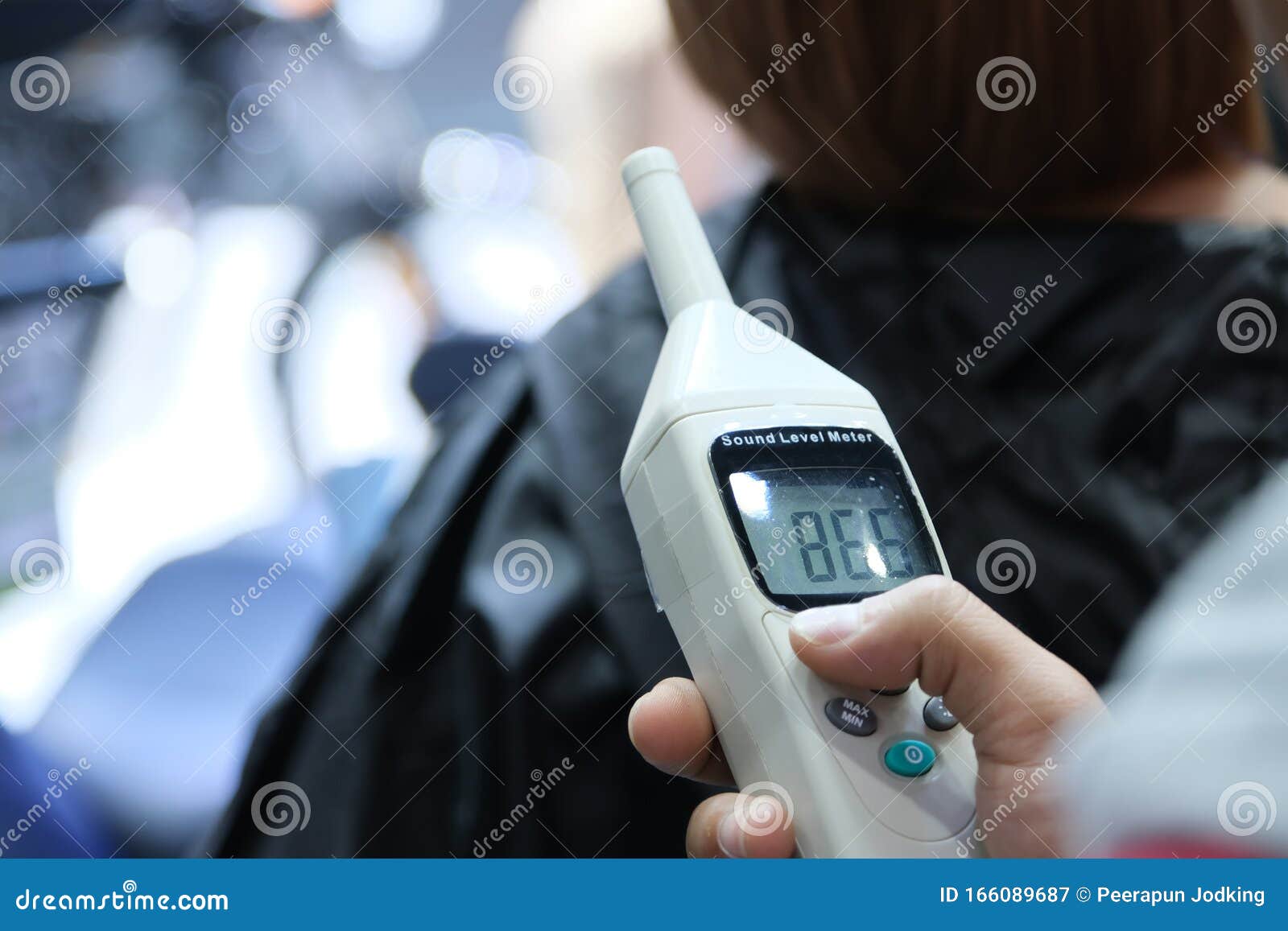 Measuring the Noise of Event in the Hall with a Sound Level Meter Stock ...