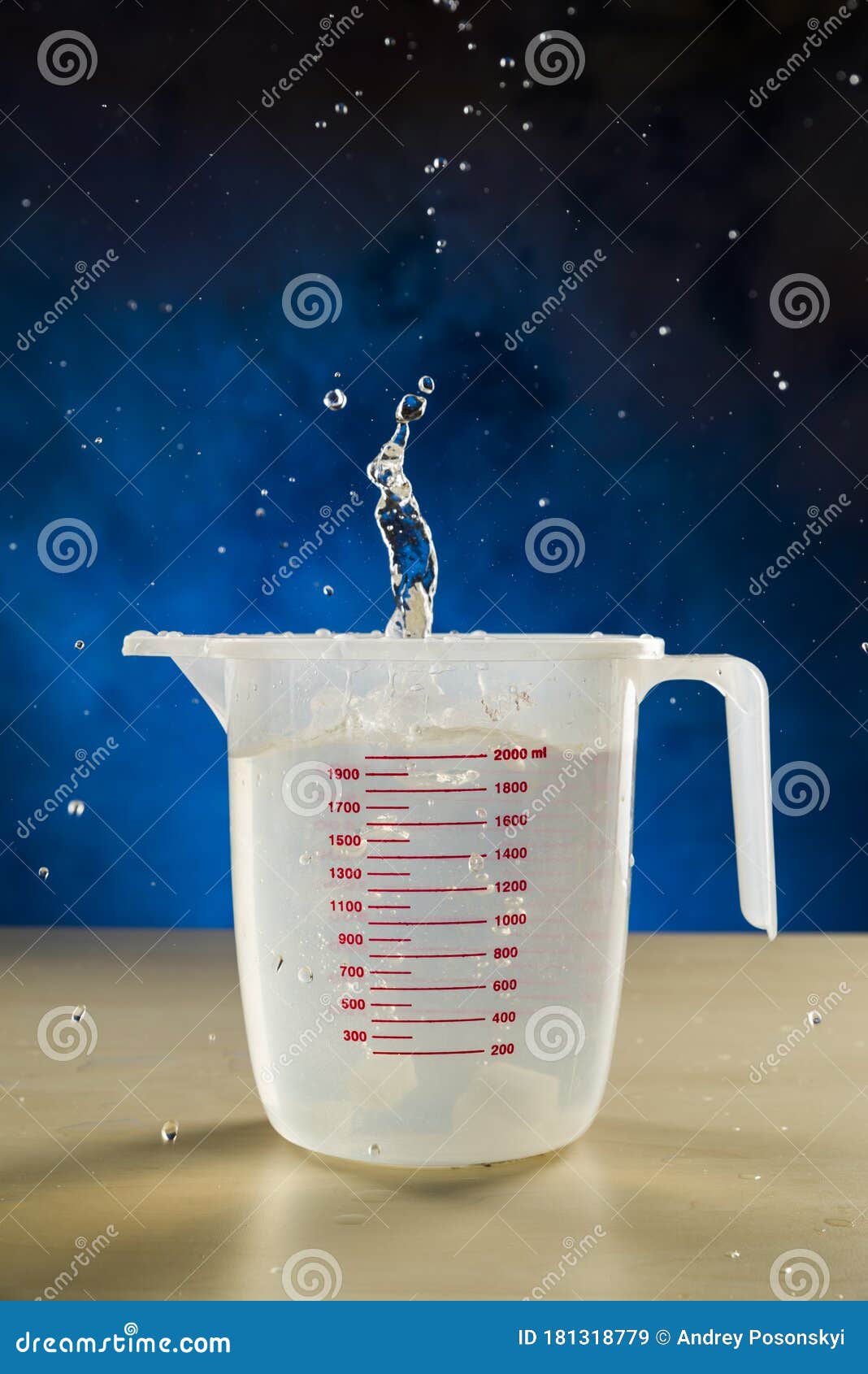 Measuring Plastic Container with a Splash Stock Image - Image of ...