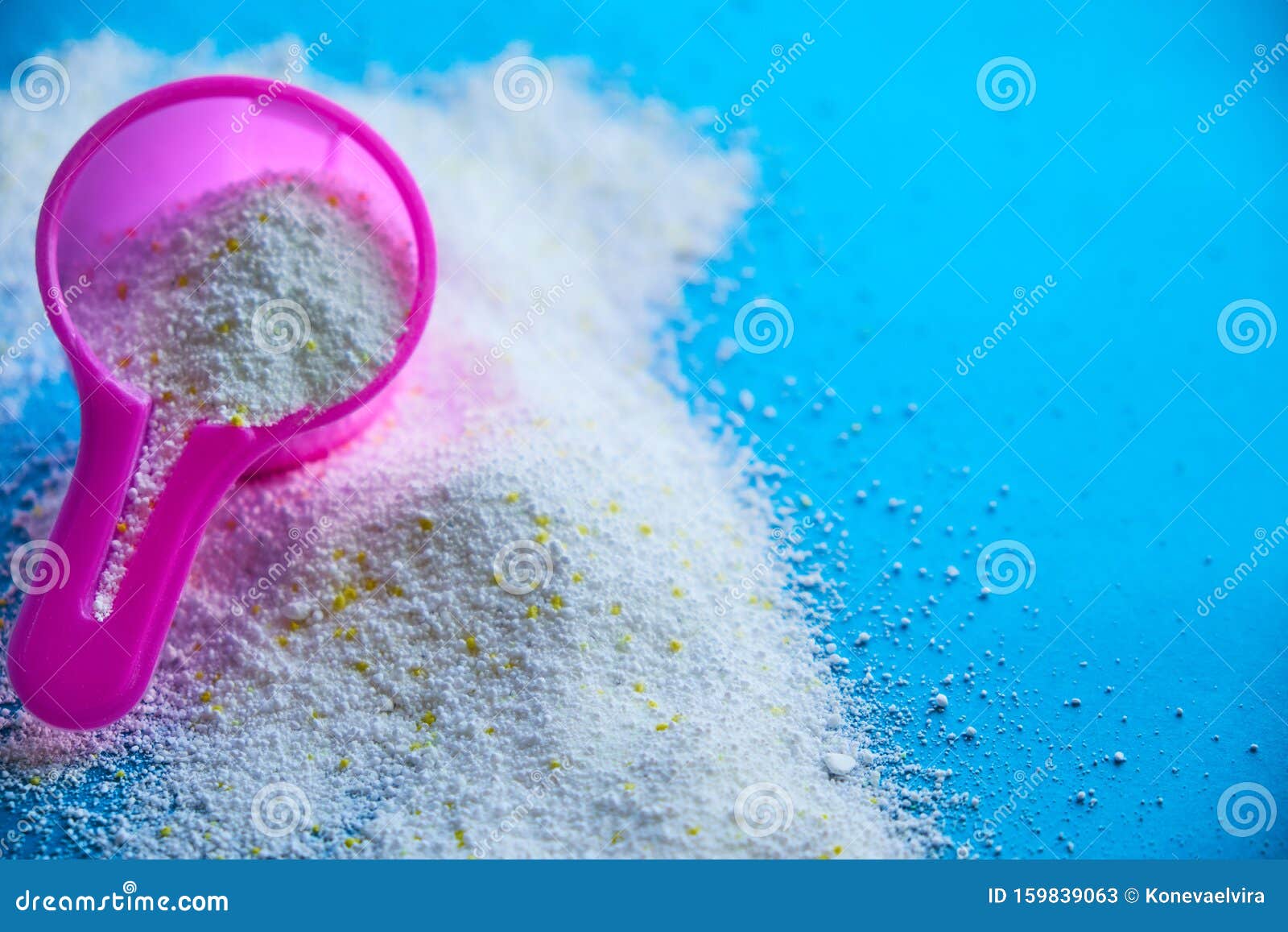 Measuring Scoop with Laundry Powder on Blue Background Stock Image ...