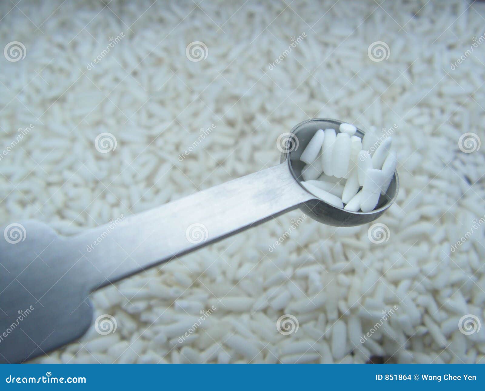 Measuring spoon with rice stock photo. Image of grains - 851864