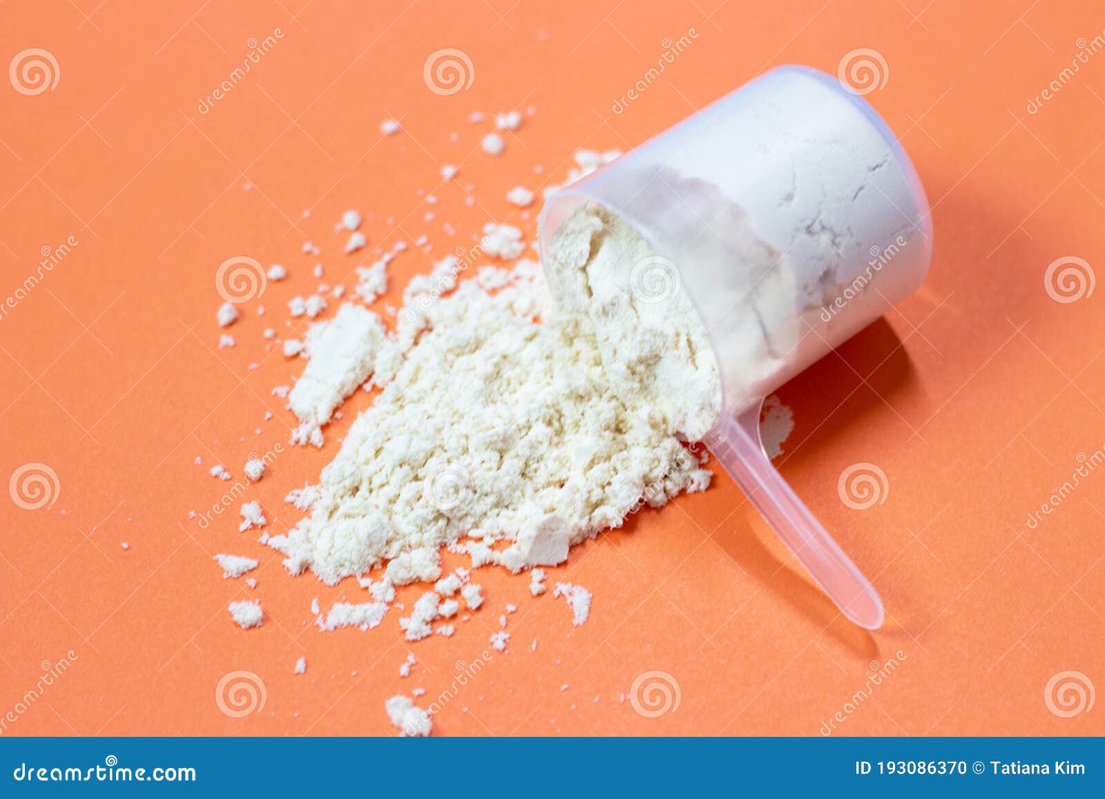Measuring Spoon with Scattered Protein Powder, Side View on a Orange ...