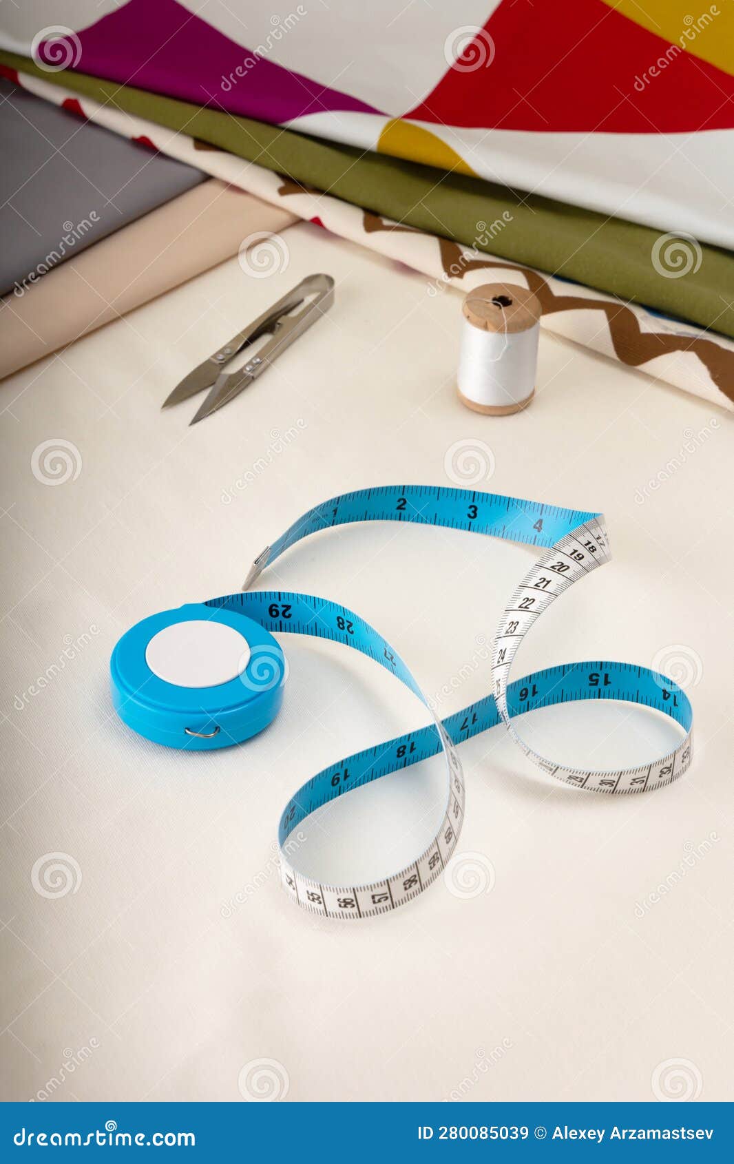 Measuring Tape Against the Background of Fabric Cuts in the Tailor S ...