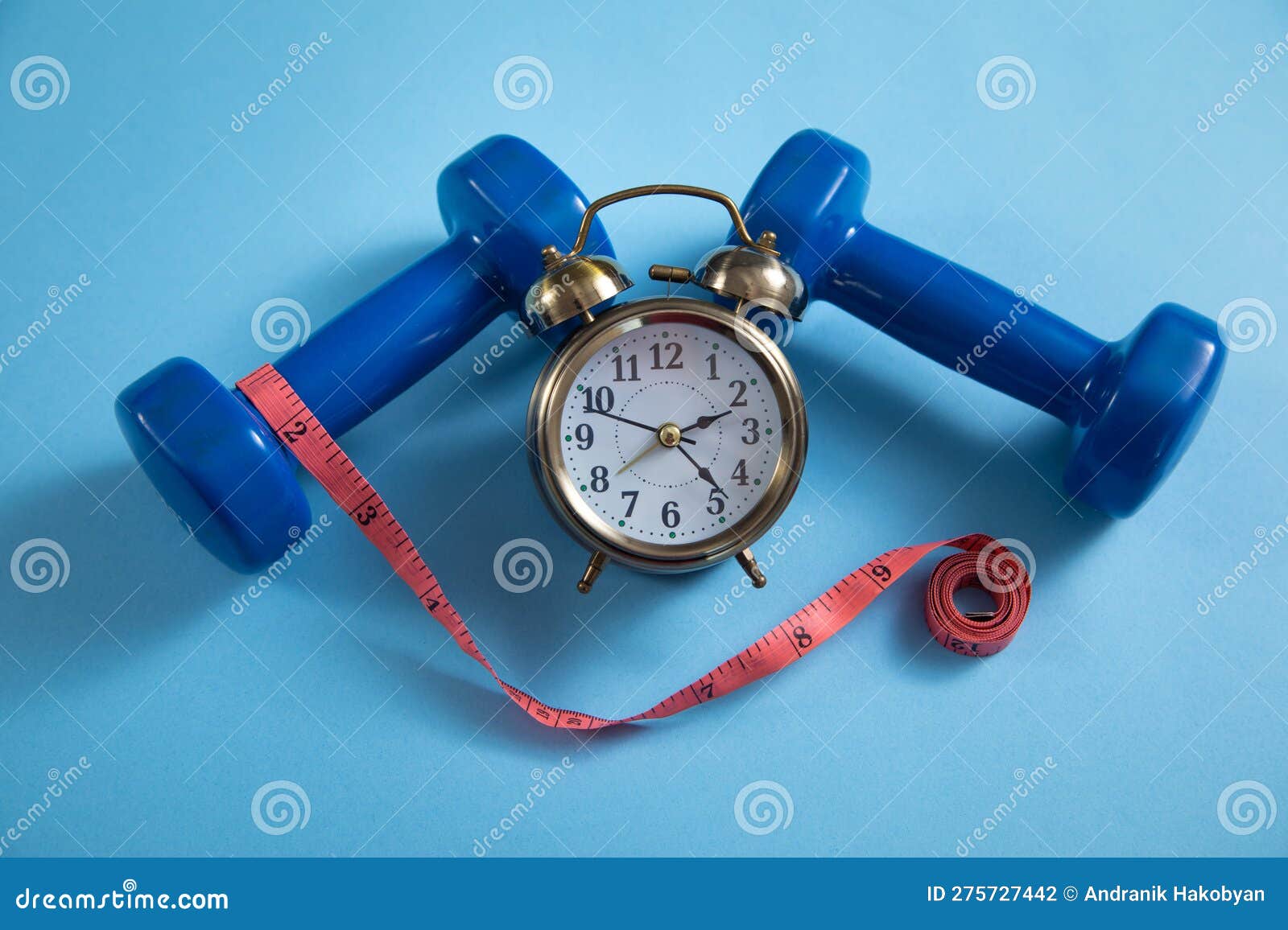 Measuring Tape, Alarm Clock and Dumbbells on the Blue Background Stock ...