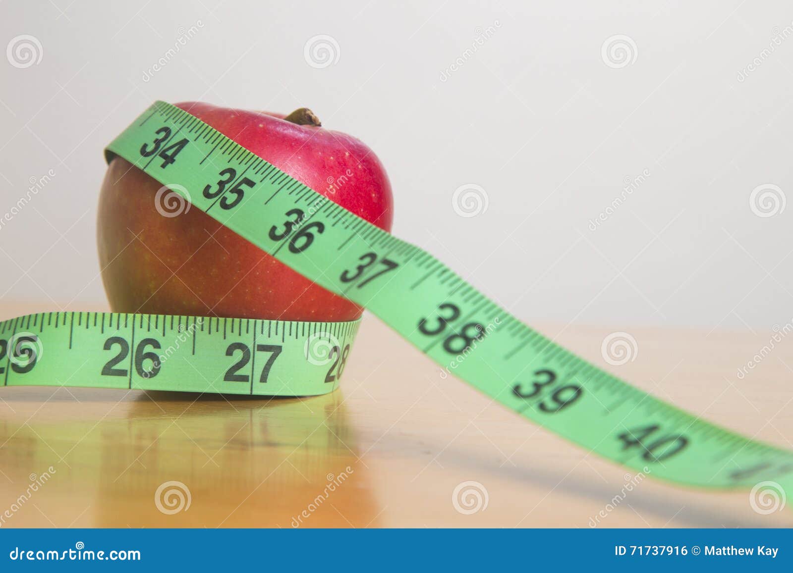 Measuring Tape Around an Apple Stock Photo - Image of fruit, tape: 71737916