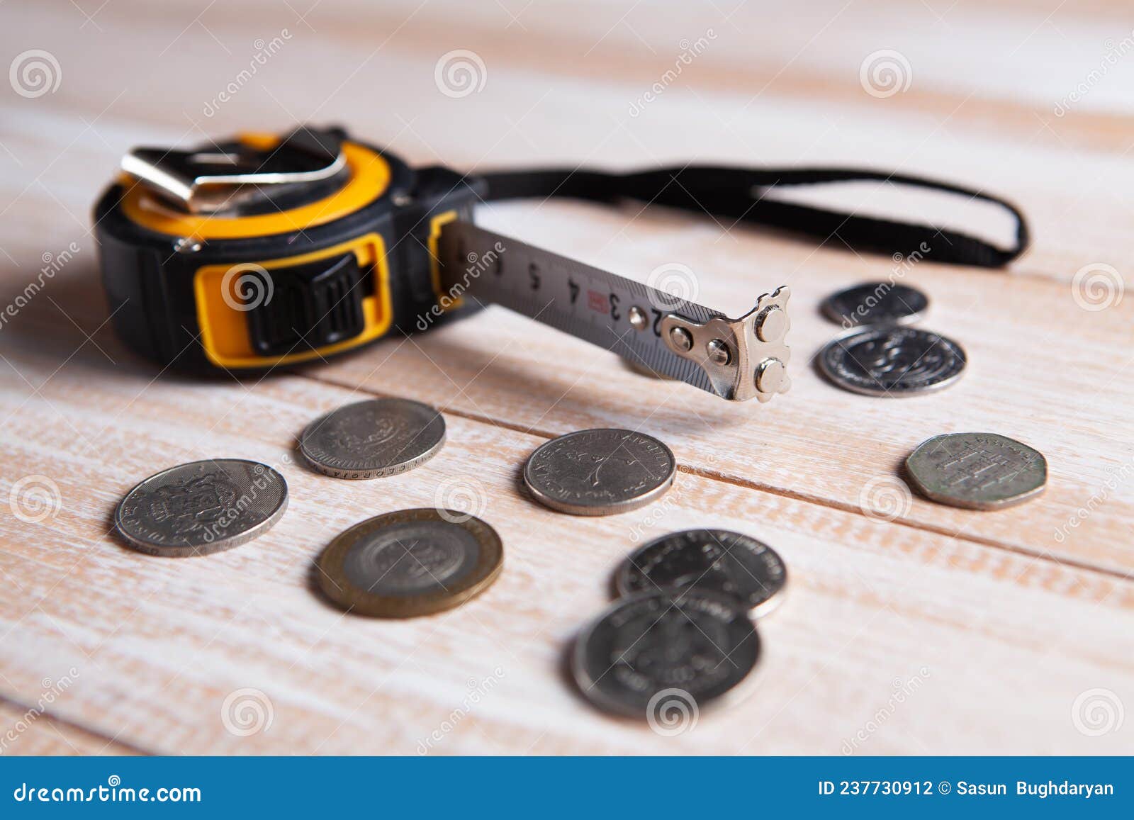 Measuring Tape and Coins on the Table Stock Photo - Image of ...