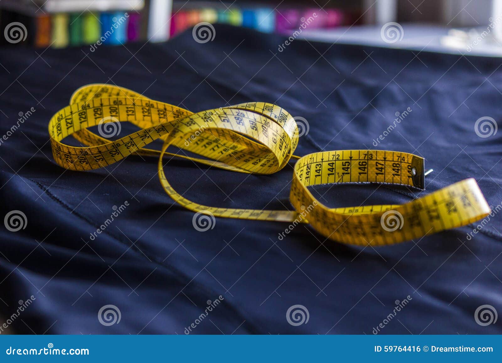 Measuring tape on fabric stock photo. Image of yellow - 59764416